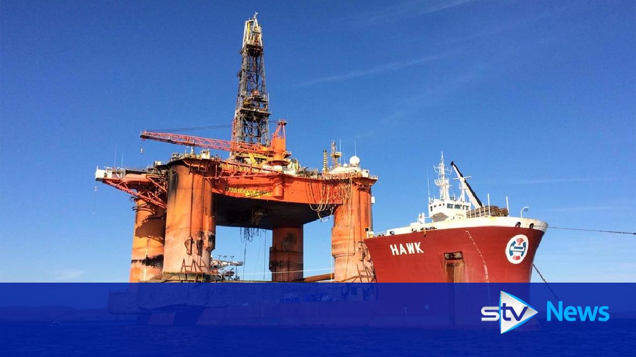 Refloated oil rig lifted onto back of colossal ship